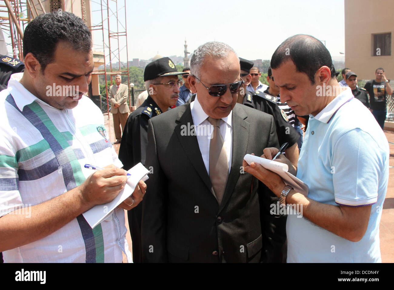 Cairo, Egypt. 15th Aug, 2013. Egyptian policemen attend the funeral of ...