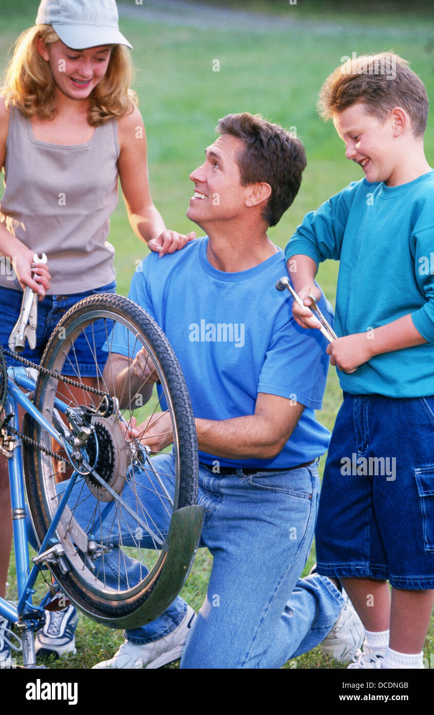 Father daughter fixing bike hi-res stock photography and images - Alamy