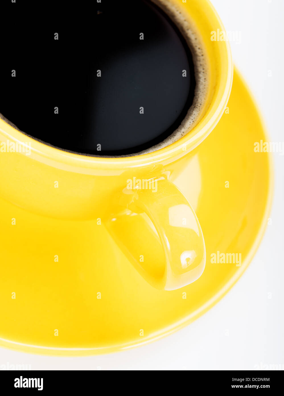 Coffee in an yellow cup Stock Photo - Alamy