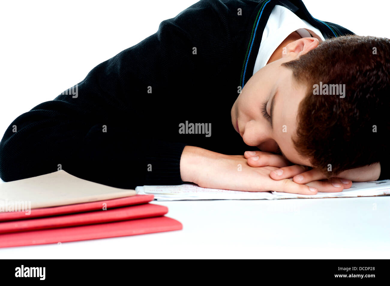 Bored student sleeping during a lecture in classroom. Hands as his ...
