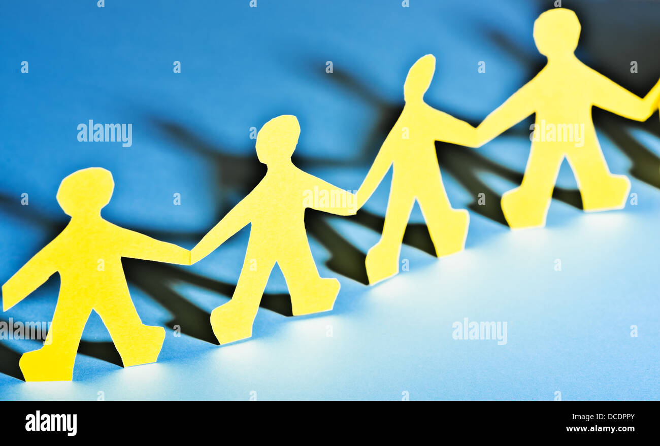 Paper people in teamworking concept Stock Photo - Alamy