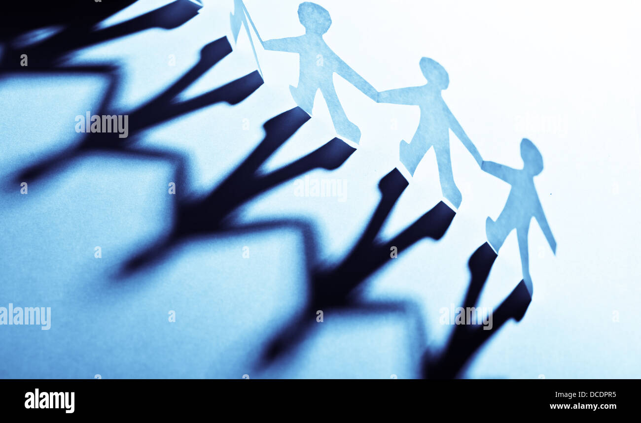 Paper people in teamworking concept Stock Photo - Alamy