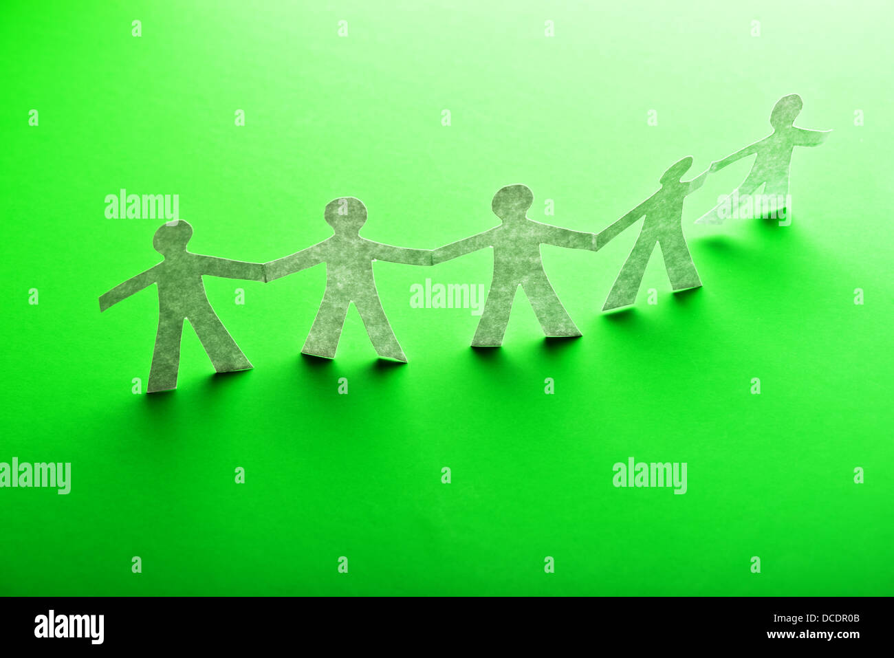 Paper people in teamworking concept Stock Photo - Alamy