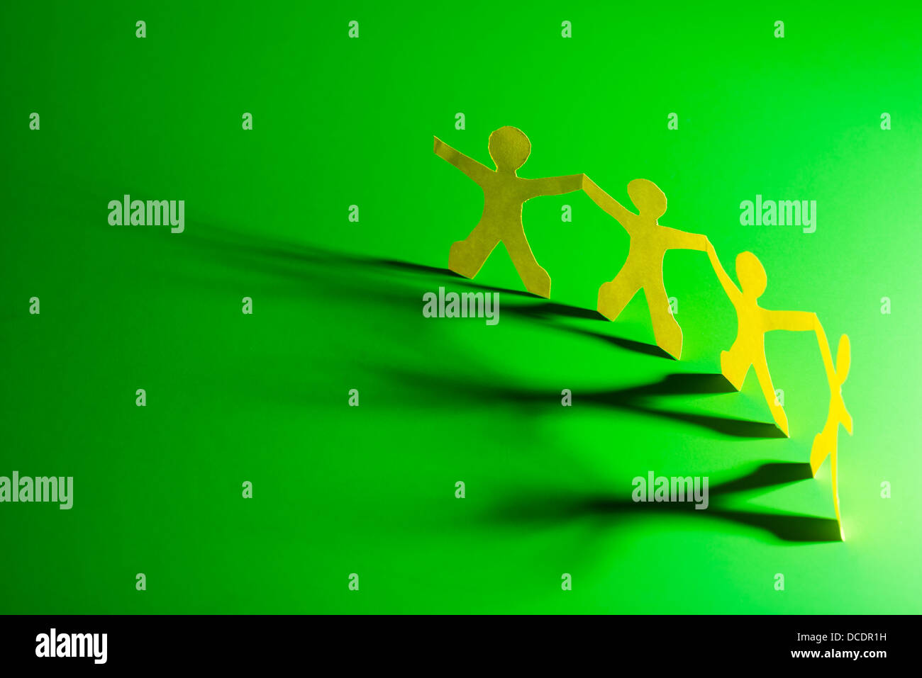 Paper people in teamworking concept Stock Photo - Alamy