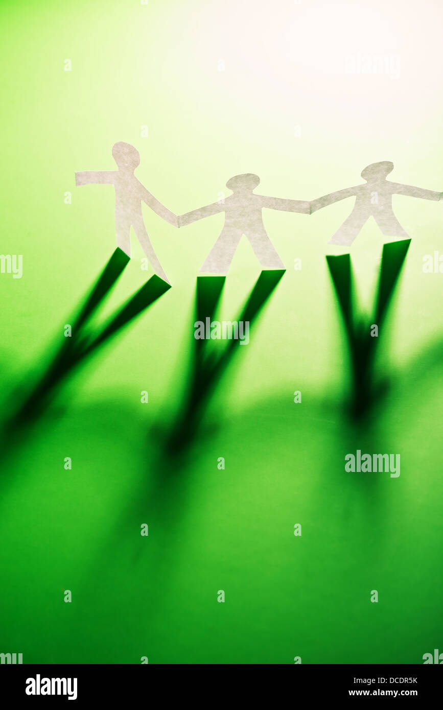 Paper people in teamworking concept Stock Photo - Alamy