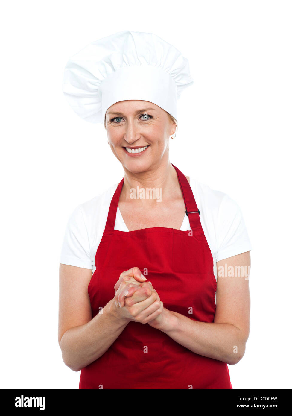 Isolated beautiful female cook looking at you and expressing happiness ...