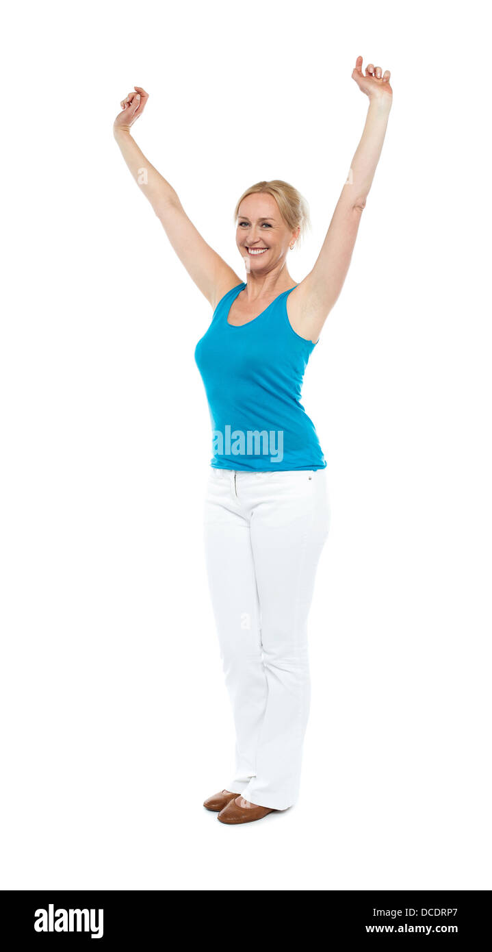 Full length shot of successful woman posing with raised arms Stock ...