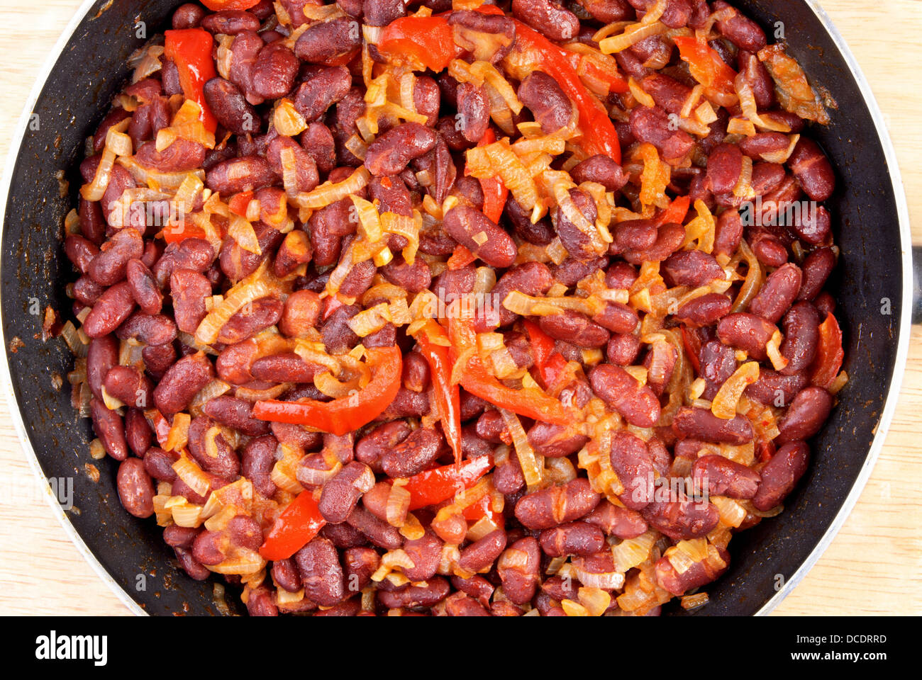Chili in a frying pan. Top view Stock Photo - Alamy