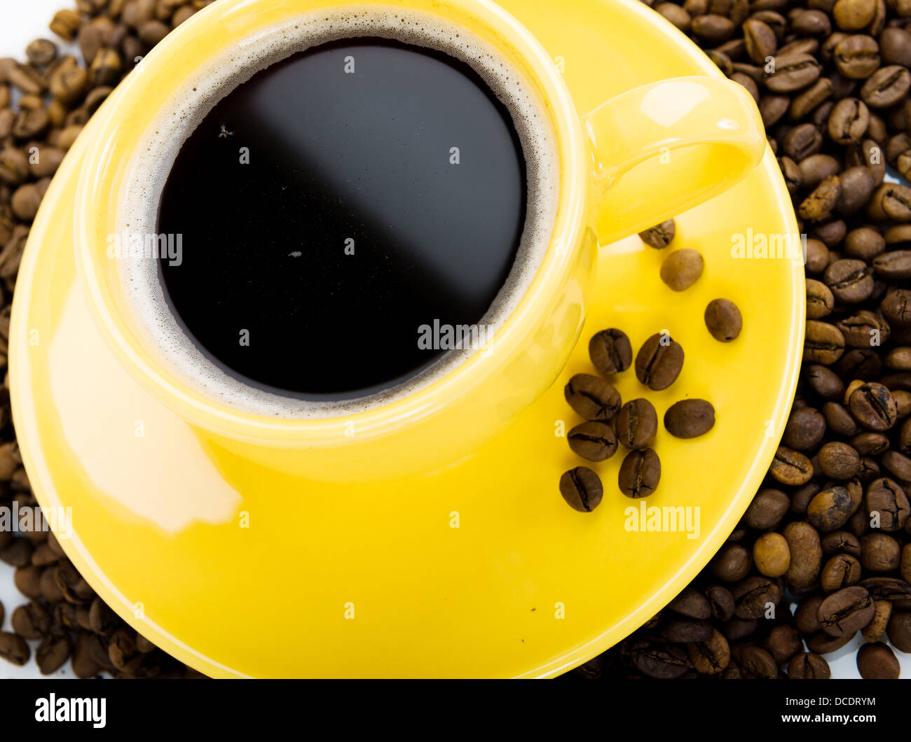 Coffee in an yellow cup Stock Photo - Alamy
