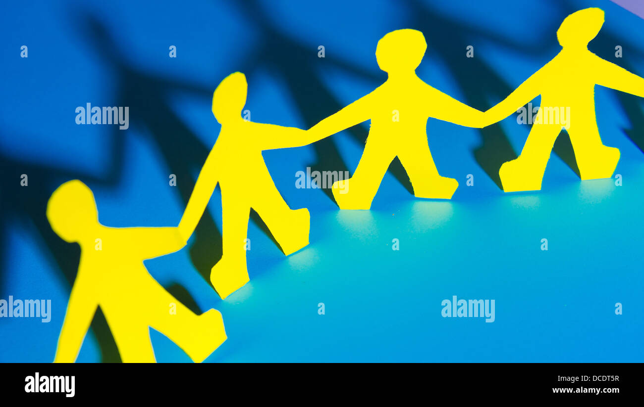 Paper people in teamworking concept Stock Photo - Alamy