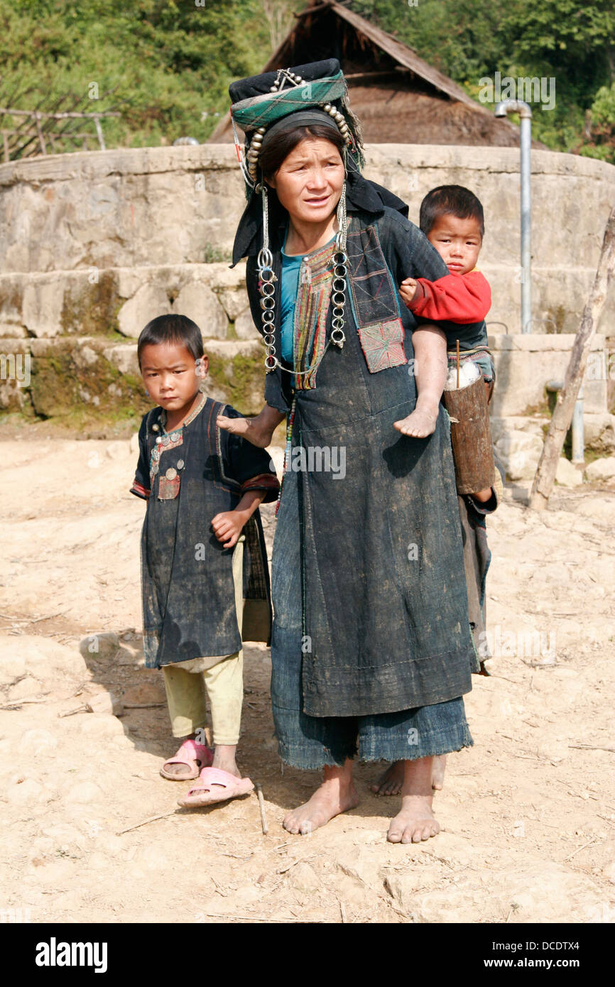 Ethnic Akha woman and children in tribal village near Phongsali, Laos ...