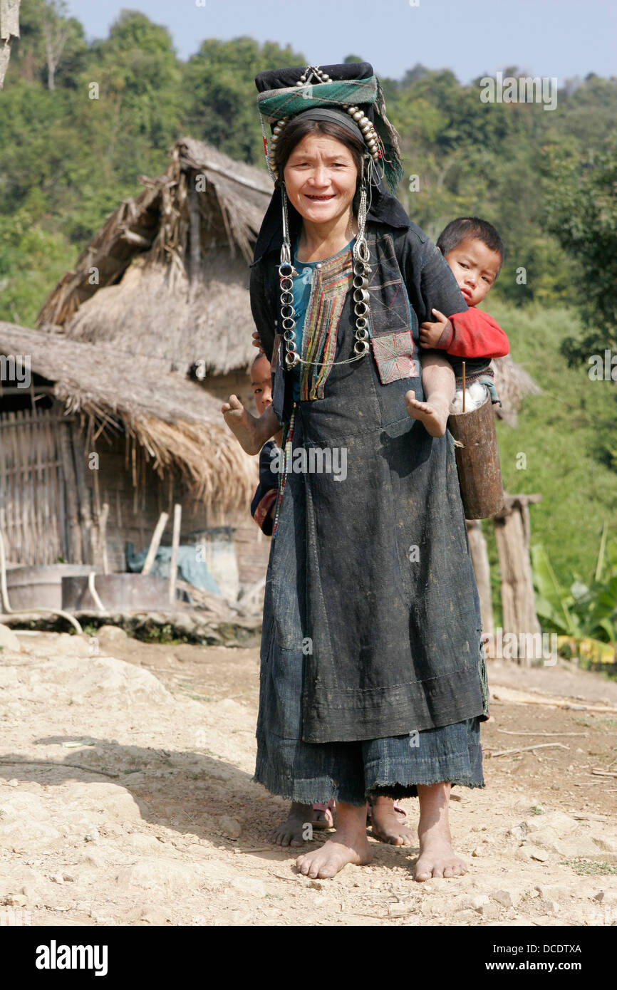 Ethnic Akha woman in tribal village near Phongsali, Laos Stock Photo ...