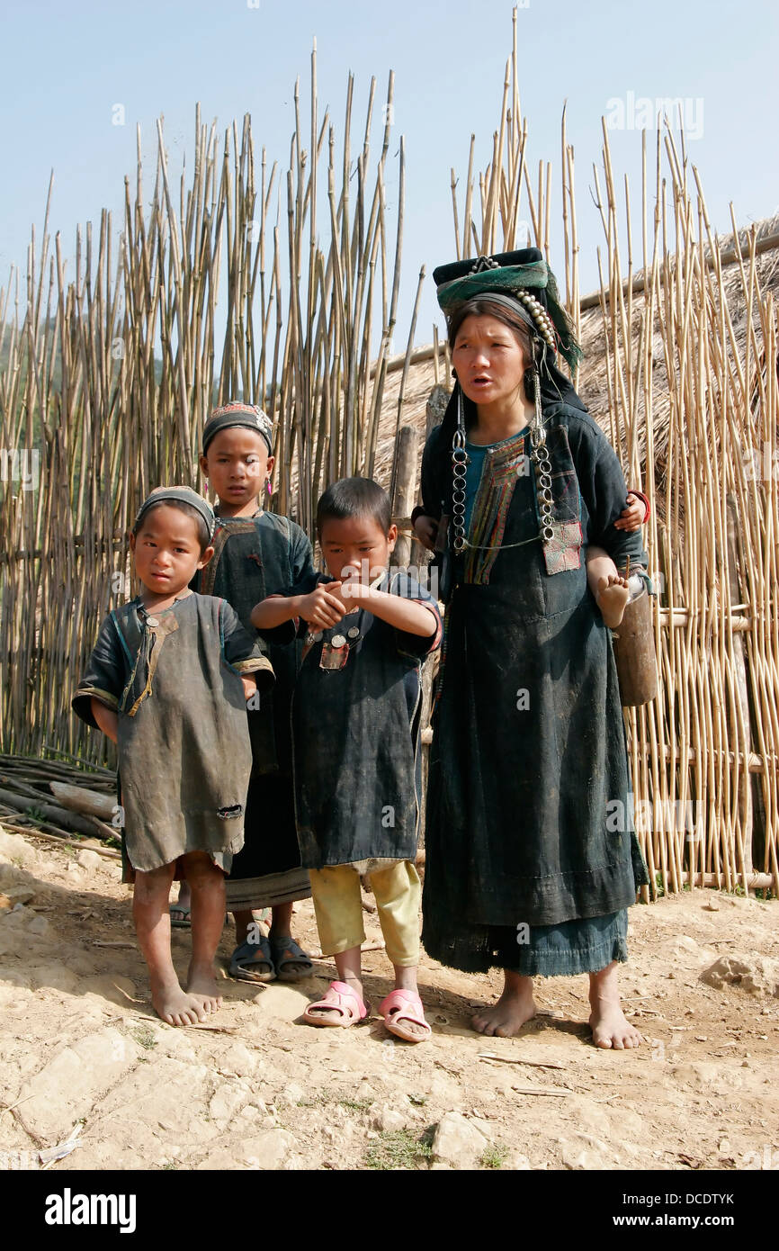 Ethnic Akha woman and children in tribal village near Phongsali, Laos ...
