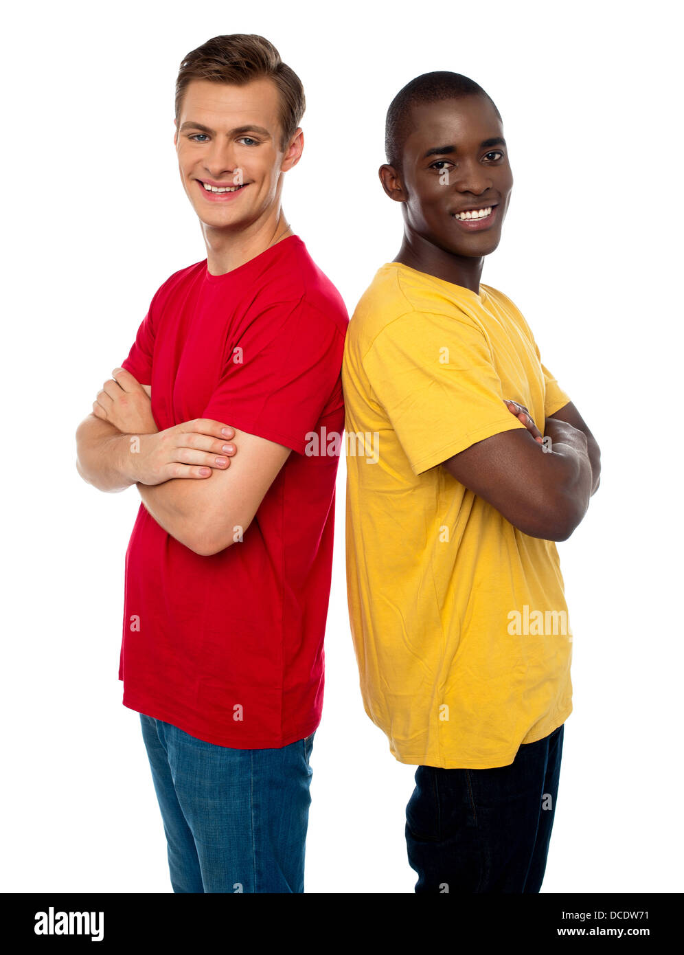 Friends posing back to back with arms crossed isolated on white Stock ...