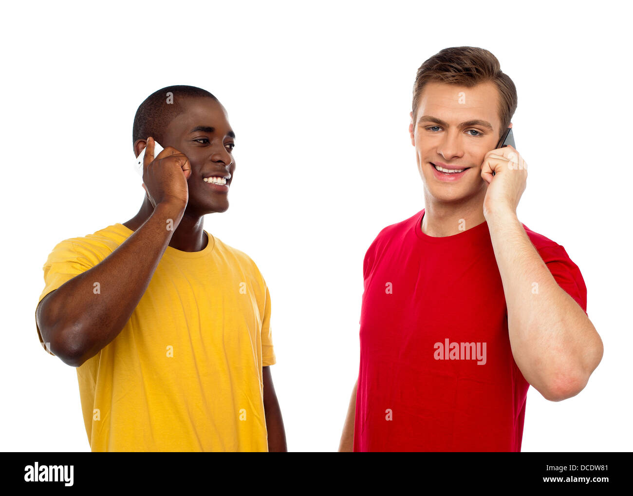 Two handsome men communicating on cellphone. African guy looking at ...