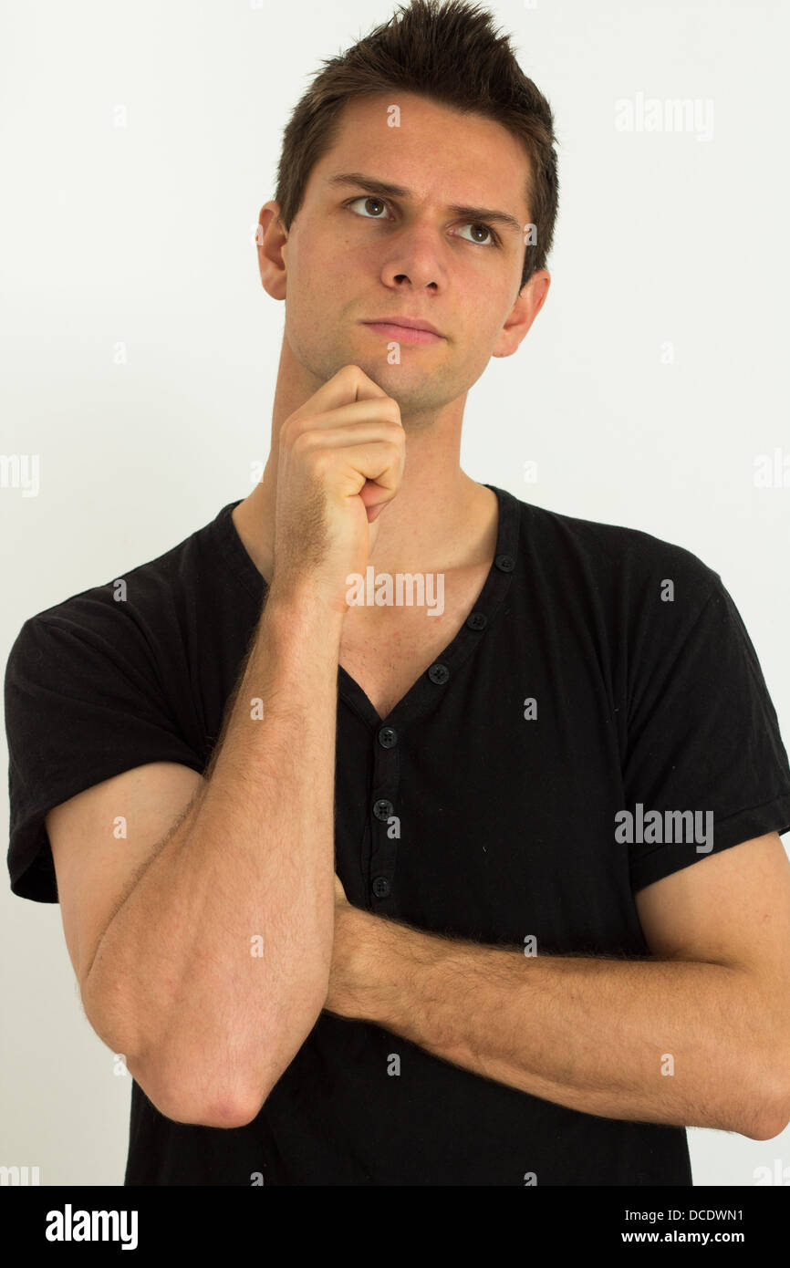 Man thinking with hand on face Stock Photo - Alamy