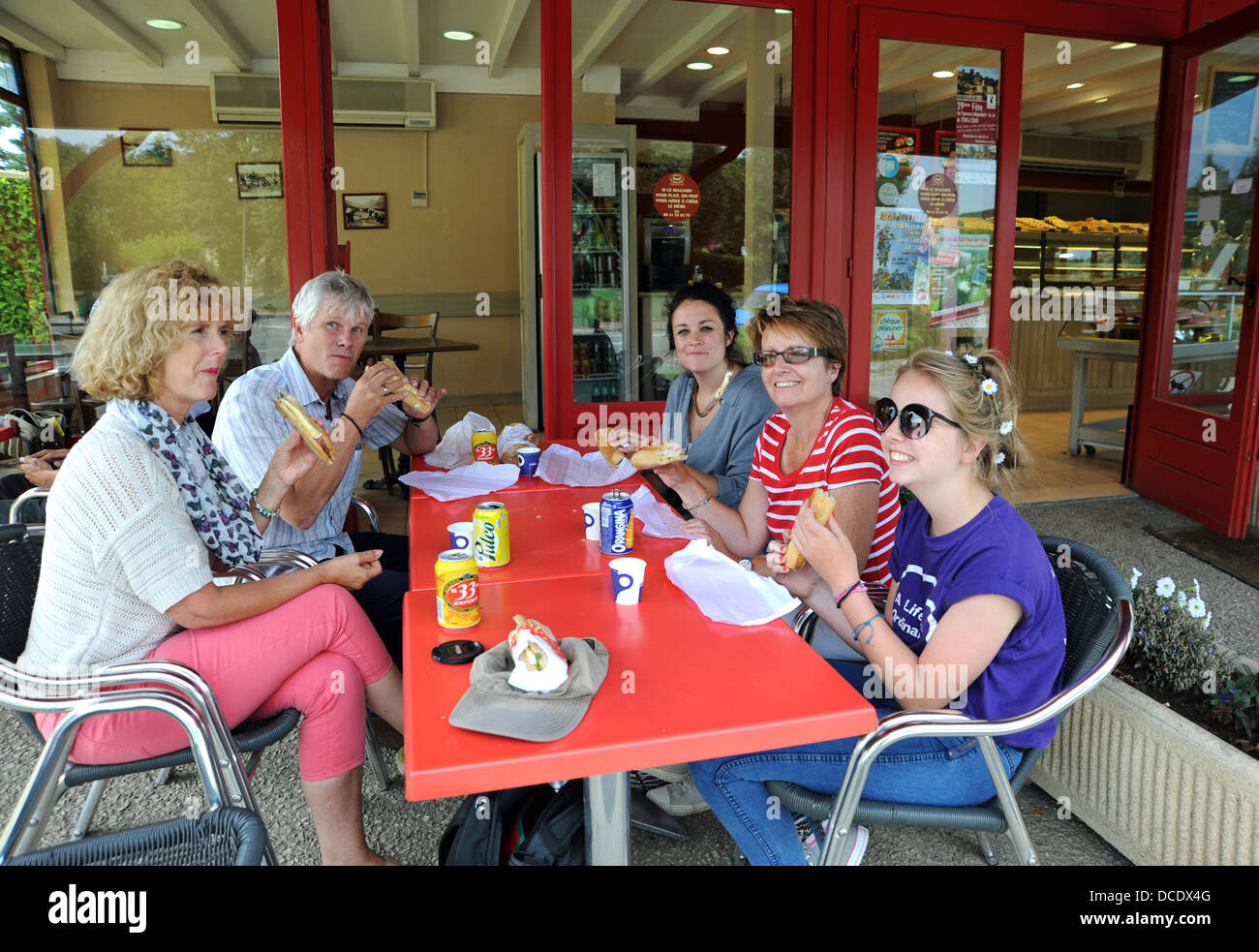 Family eating at a roadside cafe in Cahors in the Lot Region or ...