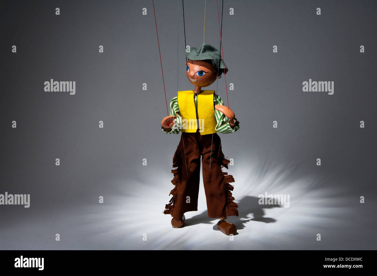 A marionette (puppet) dressed as Tex the cowboy in the spotlight Stock ...