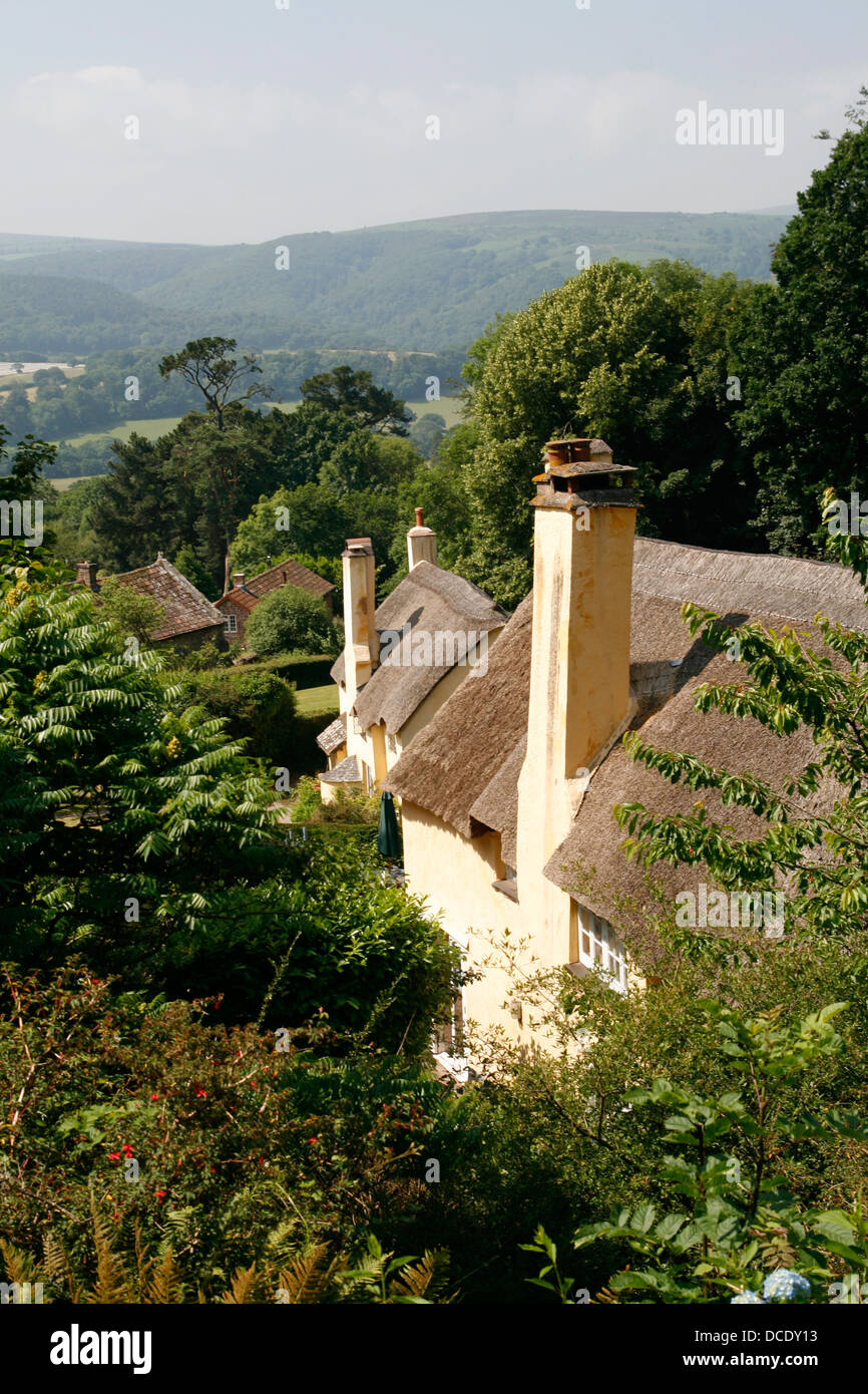 Chimneys and thatched roofs Selworthy Somerset England UK Stock Photo ...