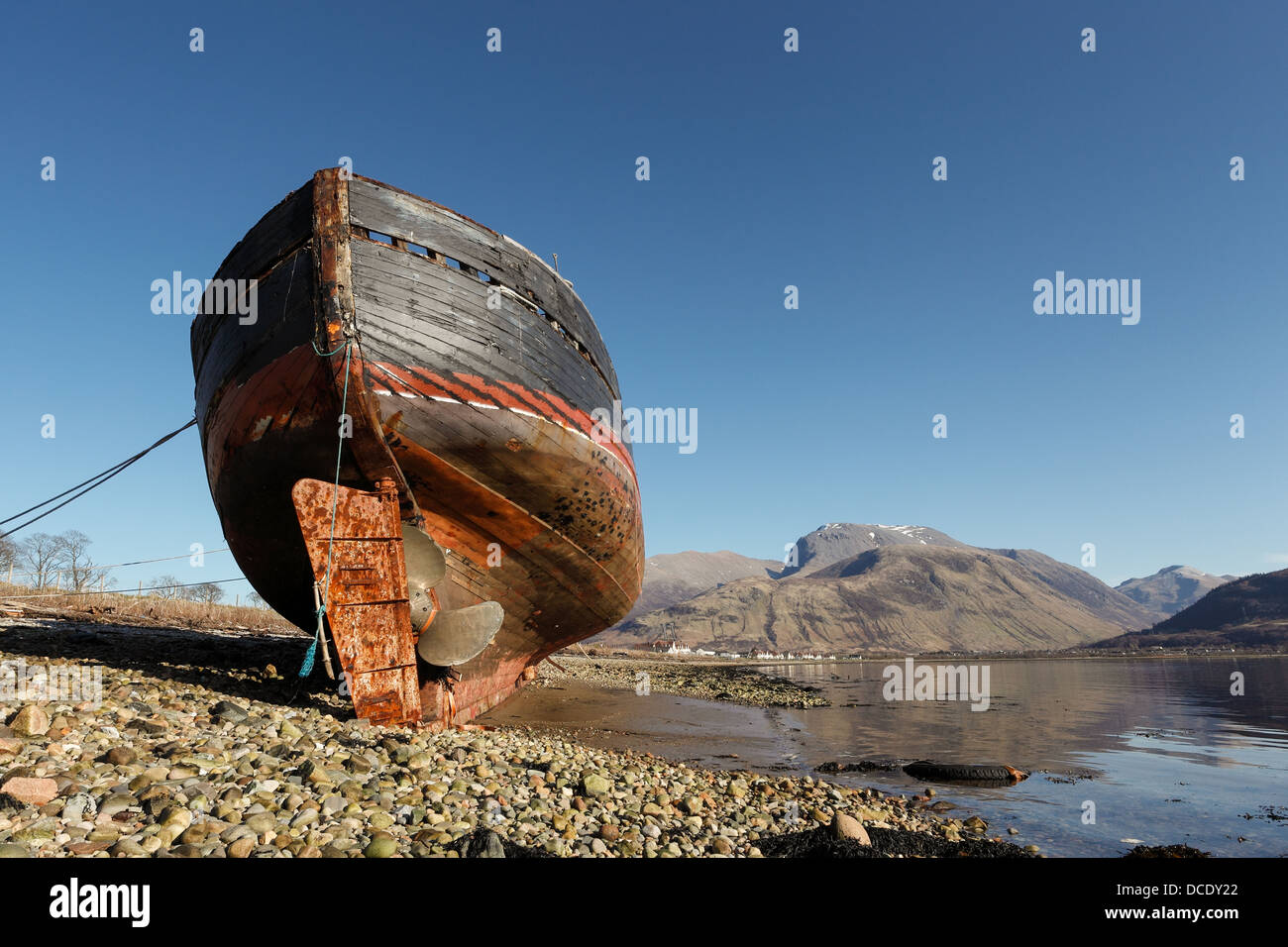 beached boat at Corpach near Fort William on shore of Loch Linnhe with ...