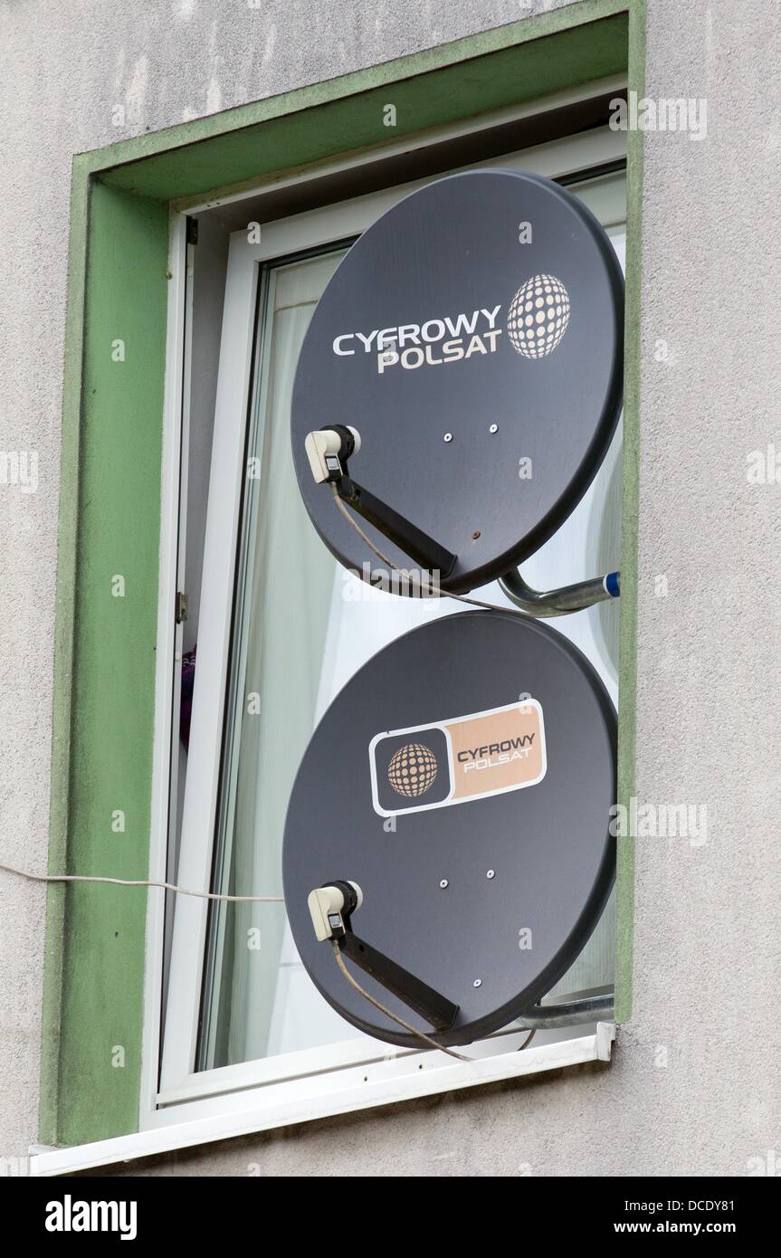 Satellite dishes are attached to a building in Badbergen, Germany, 14 ...