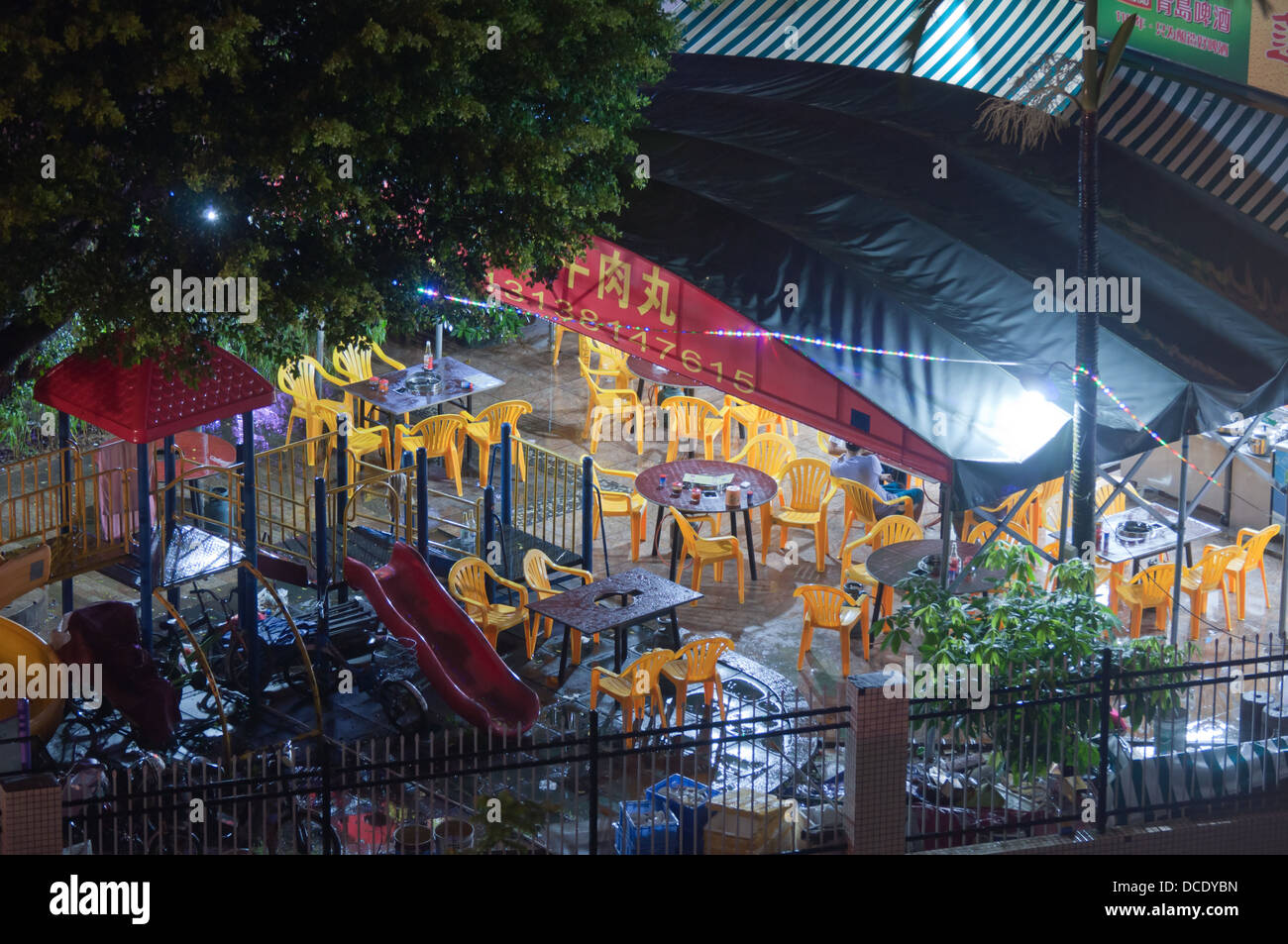 outdoor store at rain night in Zhuhai, China Stock Photo - Alamy