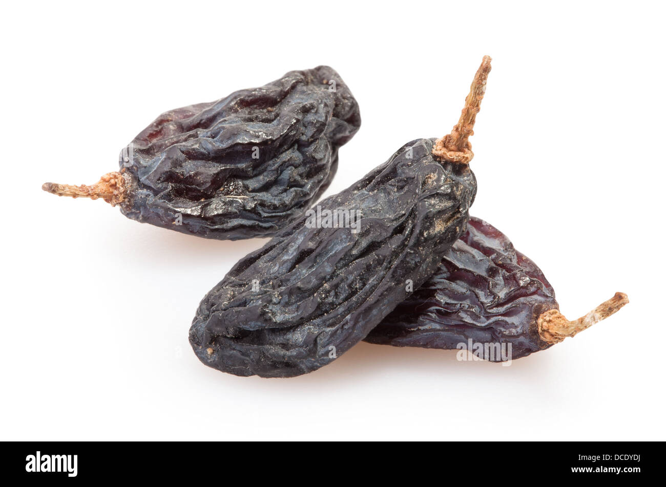 raisins black group on white background Stock Photo - Alamy