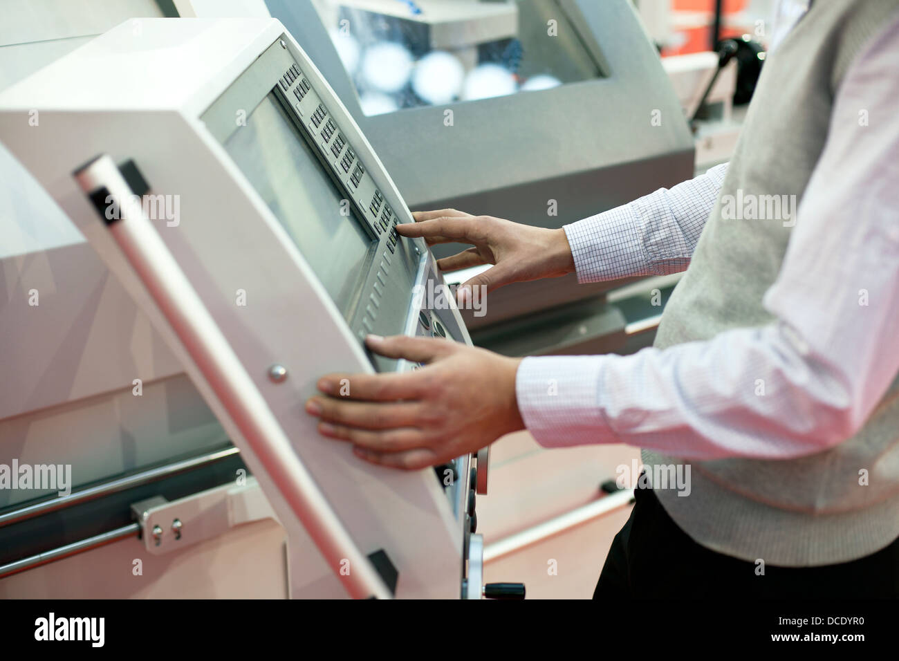 man working at programmable machine Stock Photo - Alamy