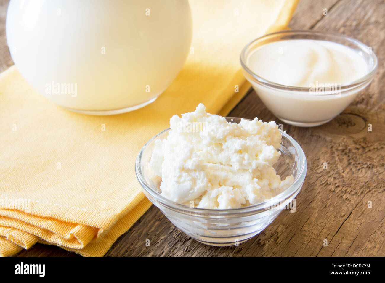 Fresh dairy products: cottage cheese in glass bowl close up, horizontal ...