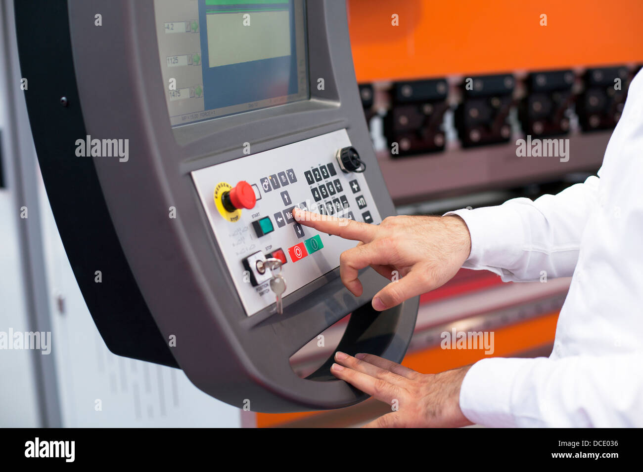 man working at programmable machine Stock Photo - Alamy