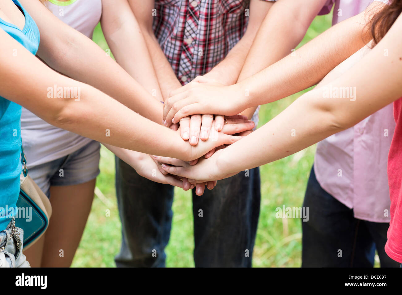 Teens' hands toghether Stock Photo - Alamy