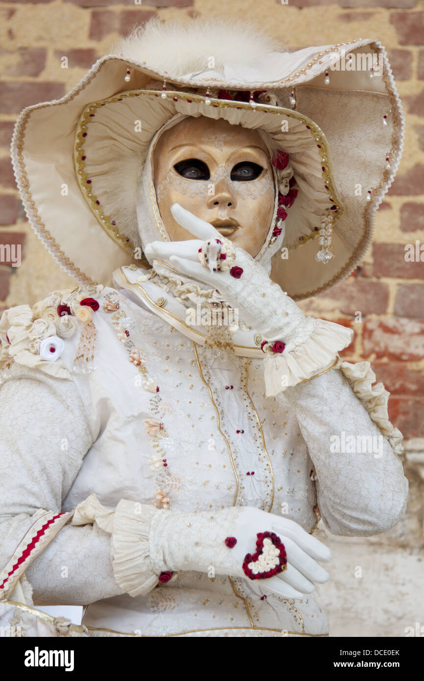 Two people with golden mask and costume hi-res stock photography and ...