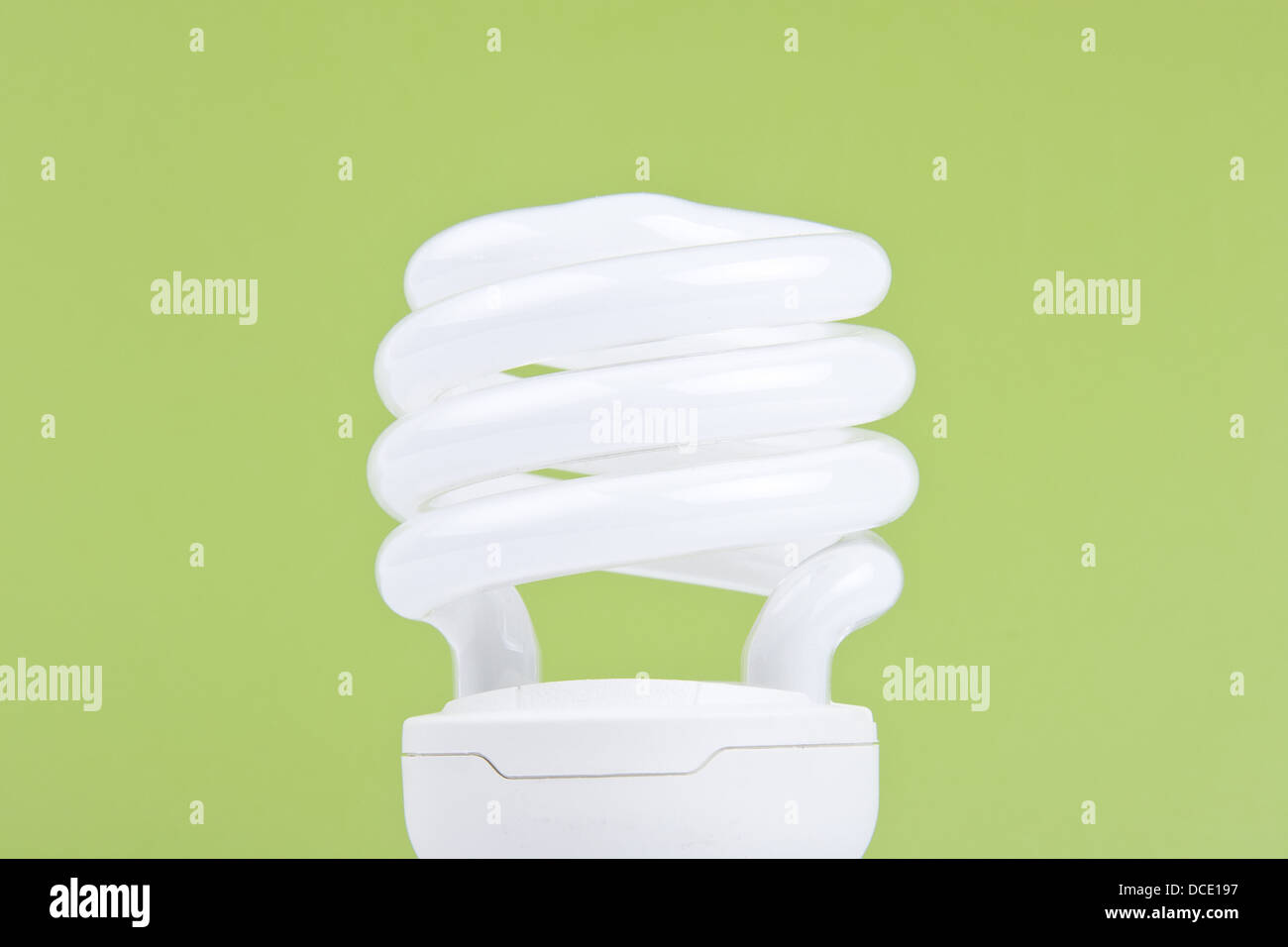 bulb on green background Stock Photo - Alamy