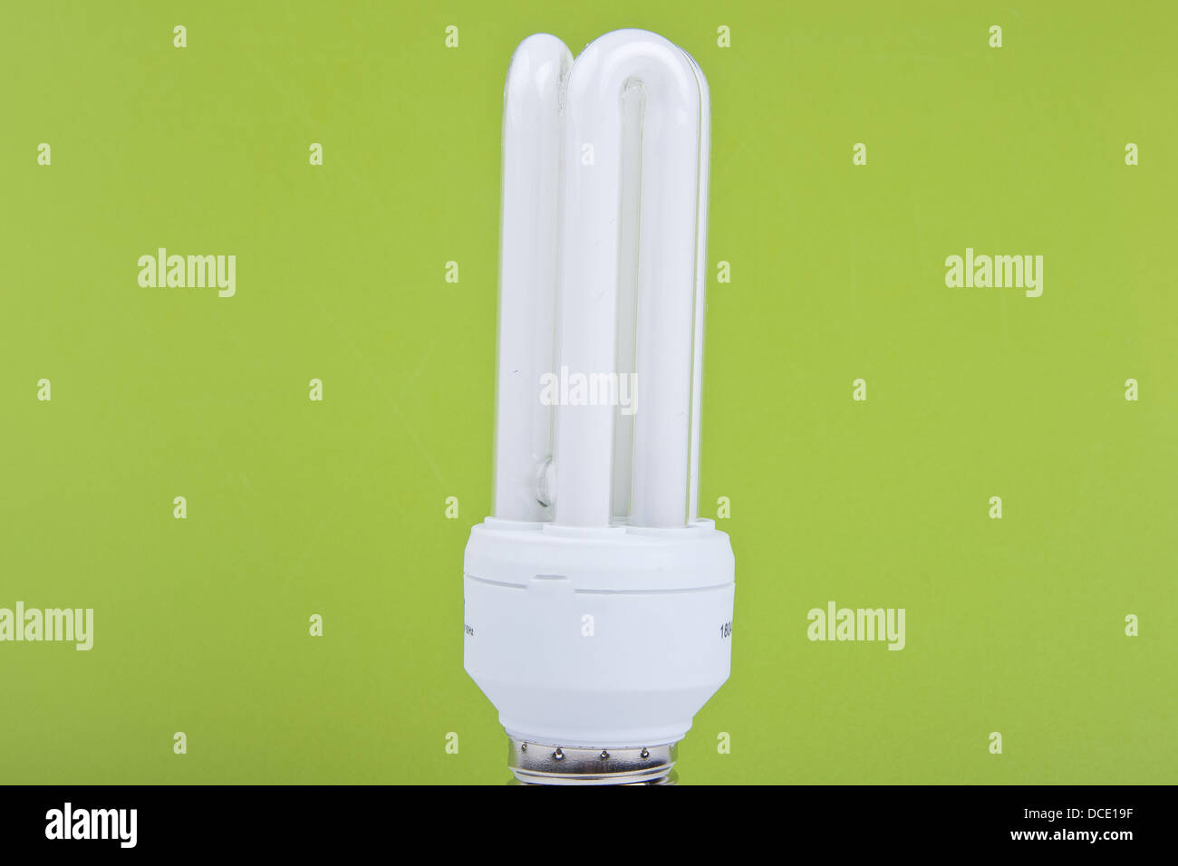 bulb on green background Stock Photo - Alamy