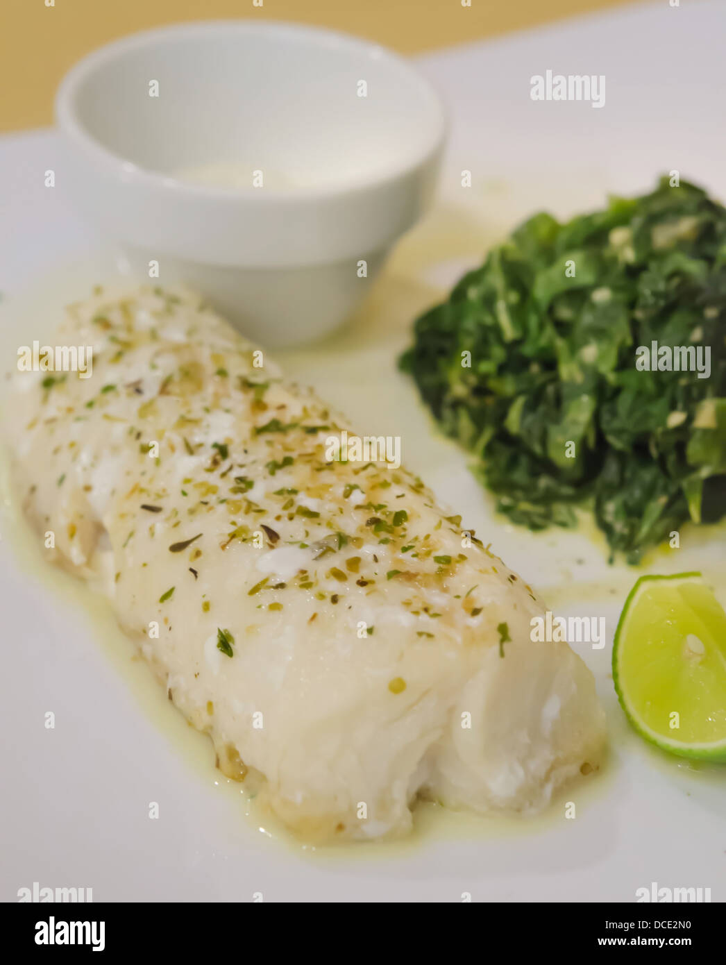 The sesoning fillet fish steak with spinach Stock Photo - Alamy