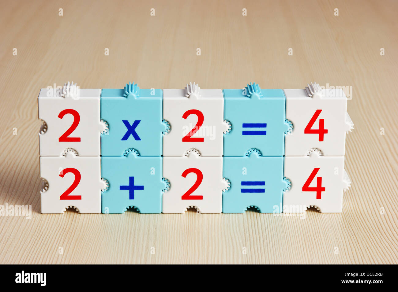 School cubes with math problems on the table Stock Photo - Alamy