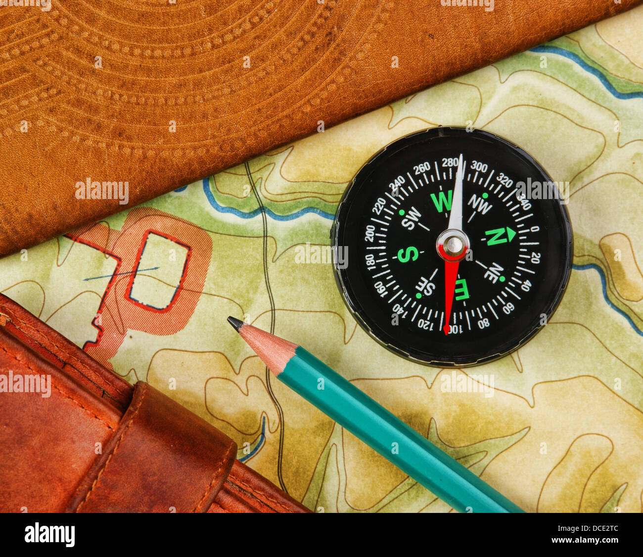 compass wallet and passport on the old map Stock Photo - Alamy