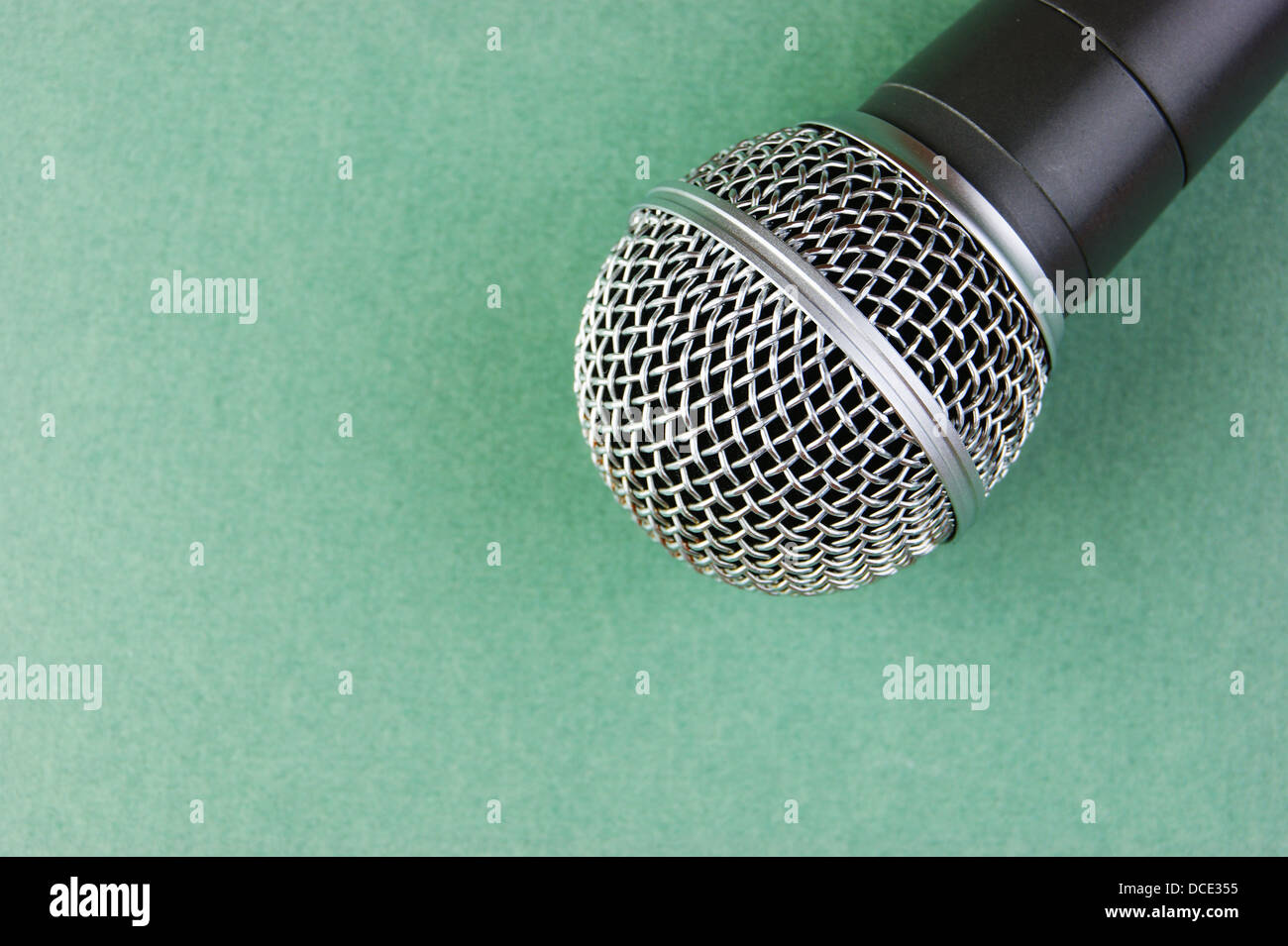 Classic dynamic microphone on a green background Stock Photo - Alamy
