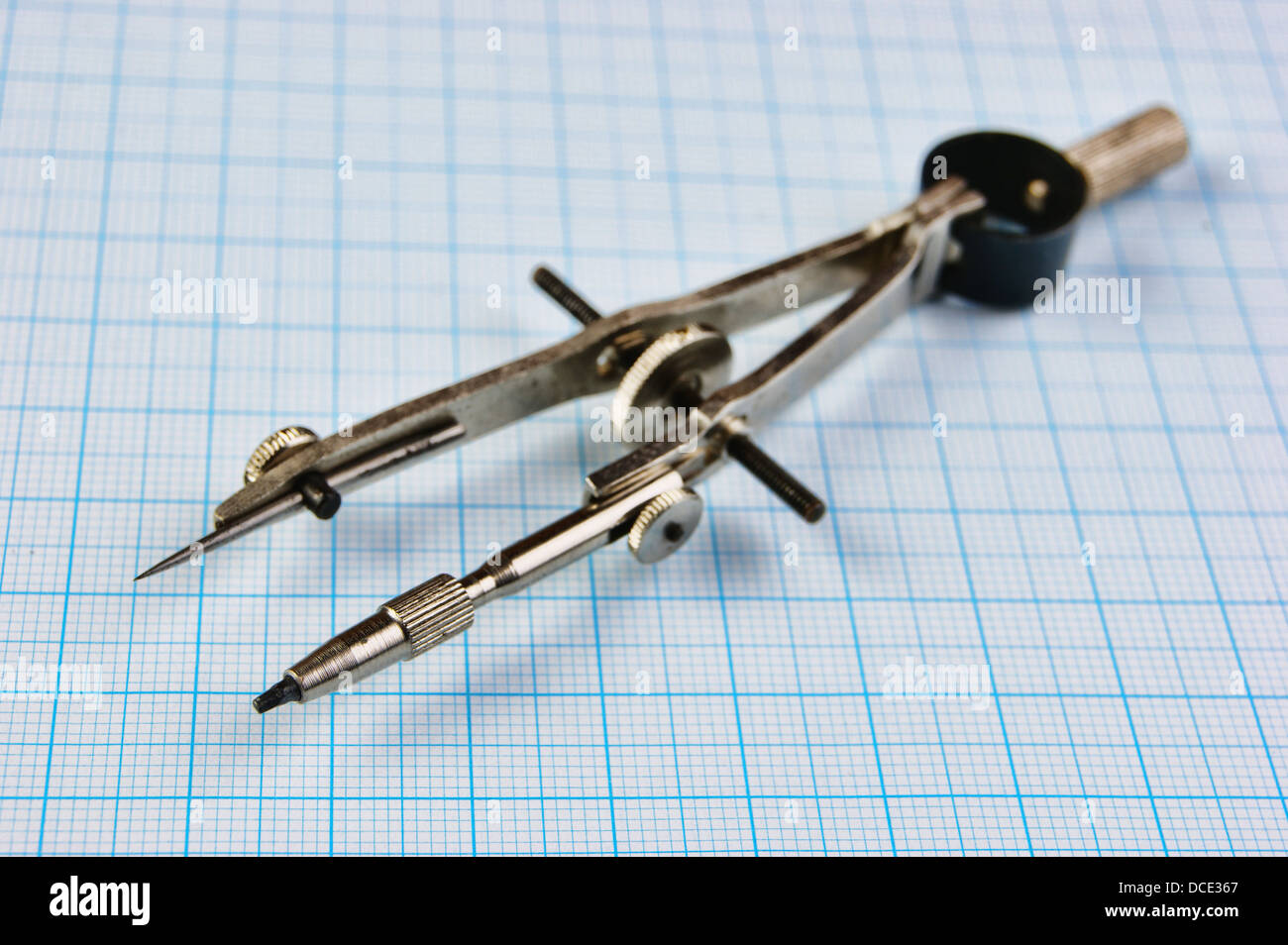 Old drawing tools on graph paper Stock Photo - Alamy