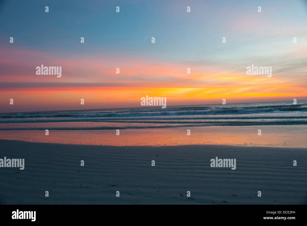 USA, Florida, Sarasota, cloudy Sunset on the Crescent Beach, Siesta Key ...
