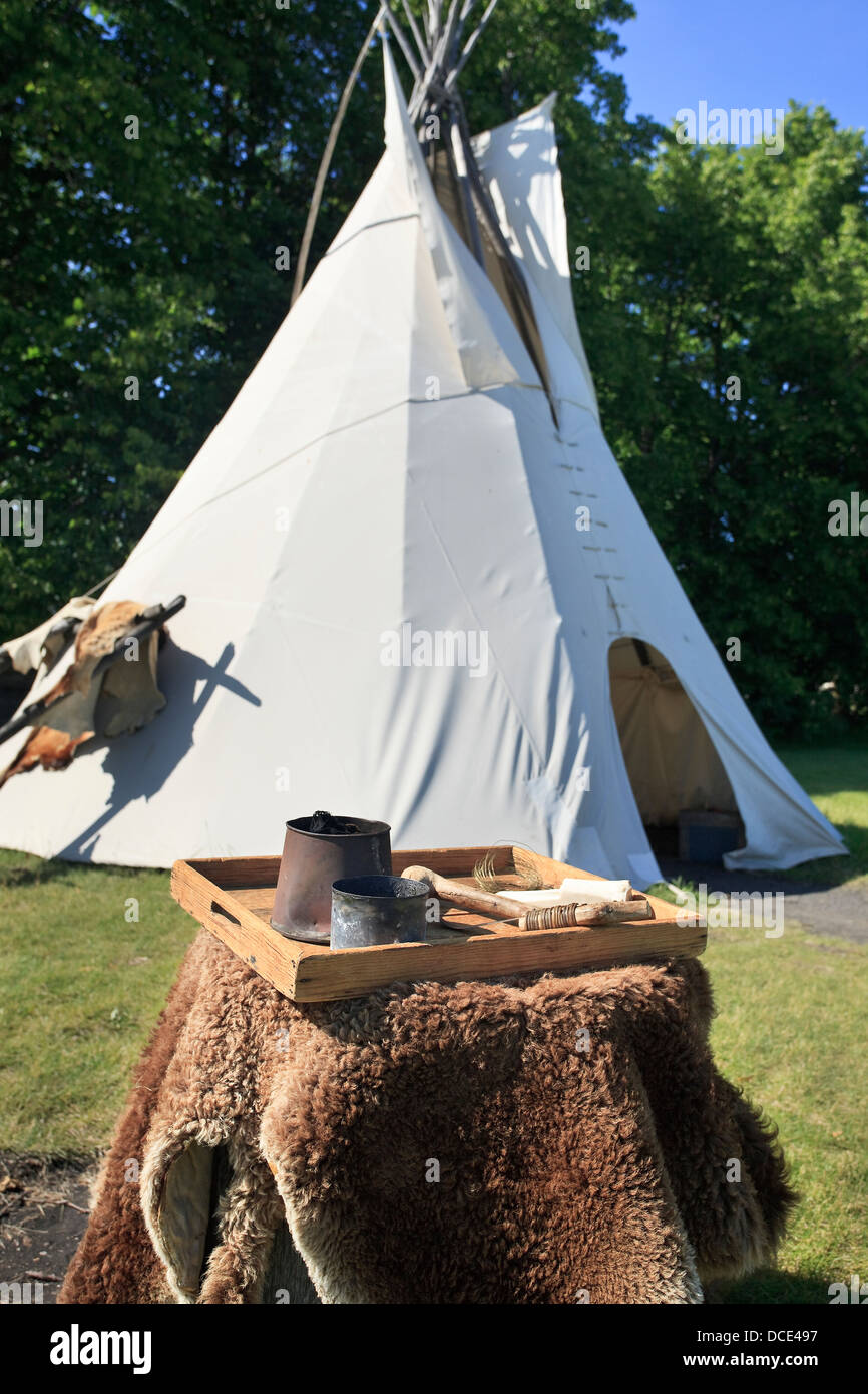 Traditional first nations campsite with teepee at lower fort garry ...