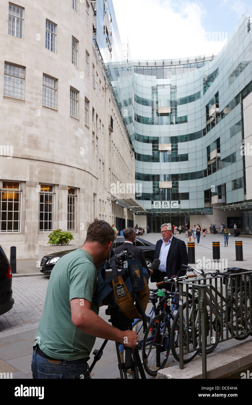 tv crew conducting interview outside bbc broadcasting house London ...