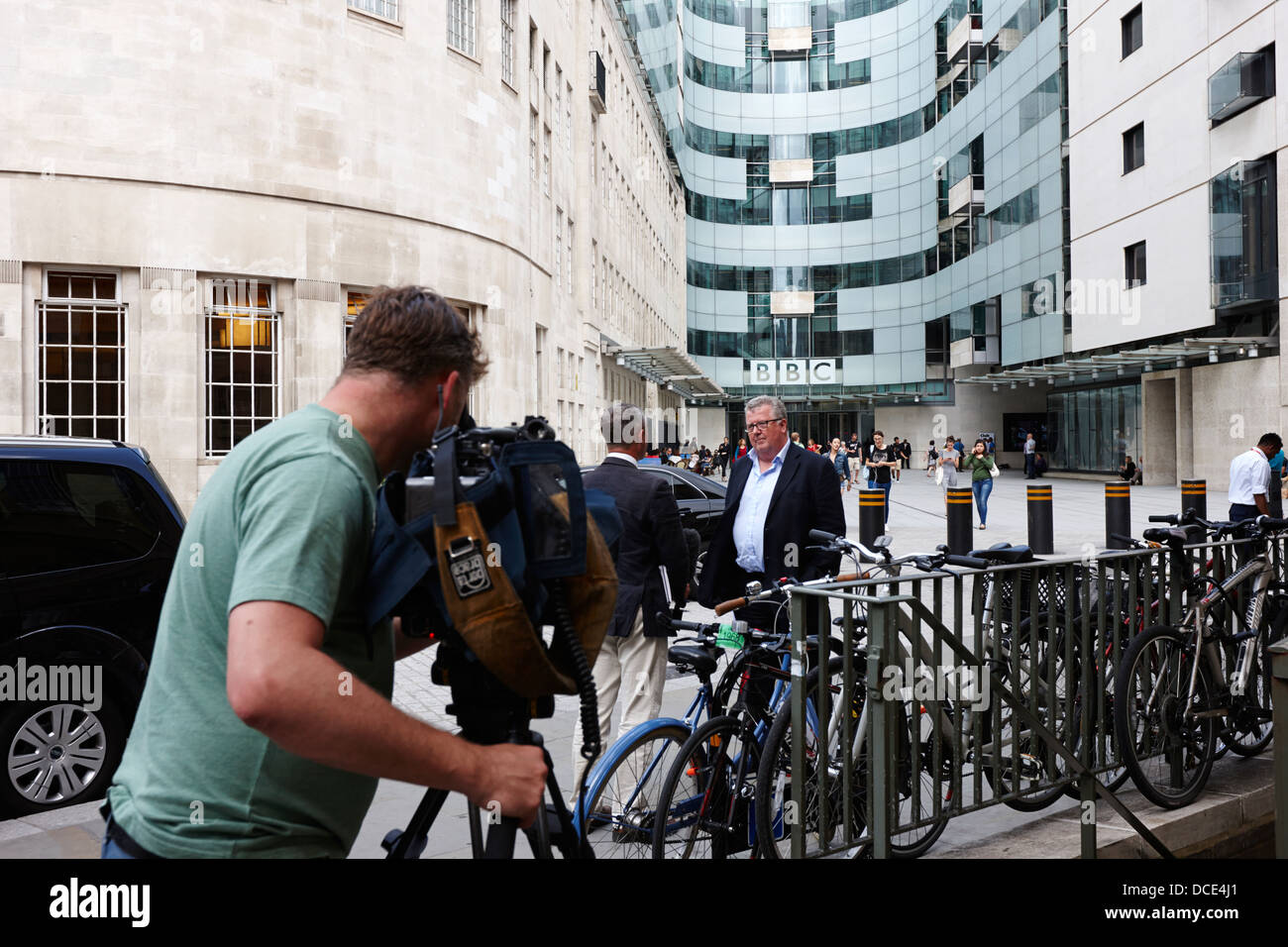 tv crew conducting interview outside bbc broadcasting house London ...