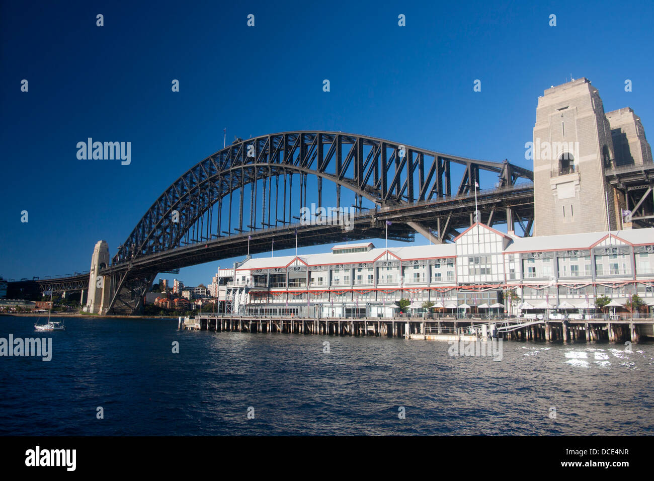 Sydney Harbour Bridge from Walsh Bay with finger wharf in foreground ...