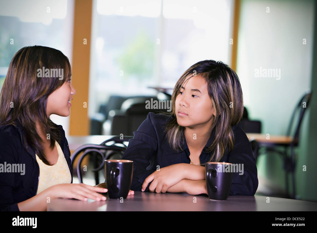 Two Teenage Friends Talking Stock Photo - Alamy