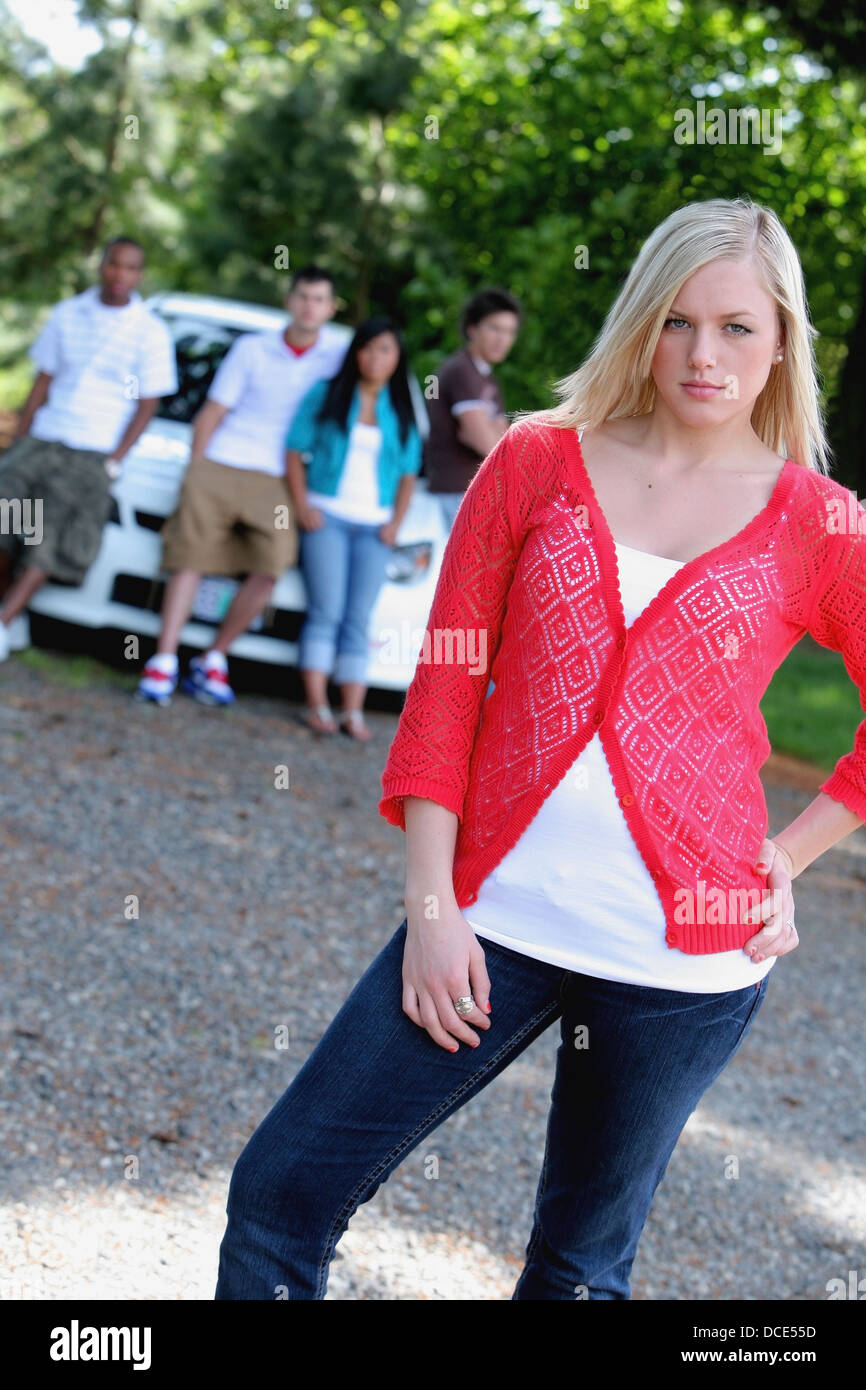 Angry Woman Standing Separate From Her Friends Stock Photo - Alamy