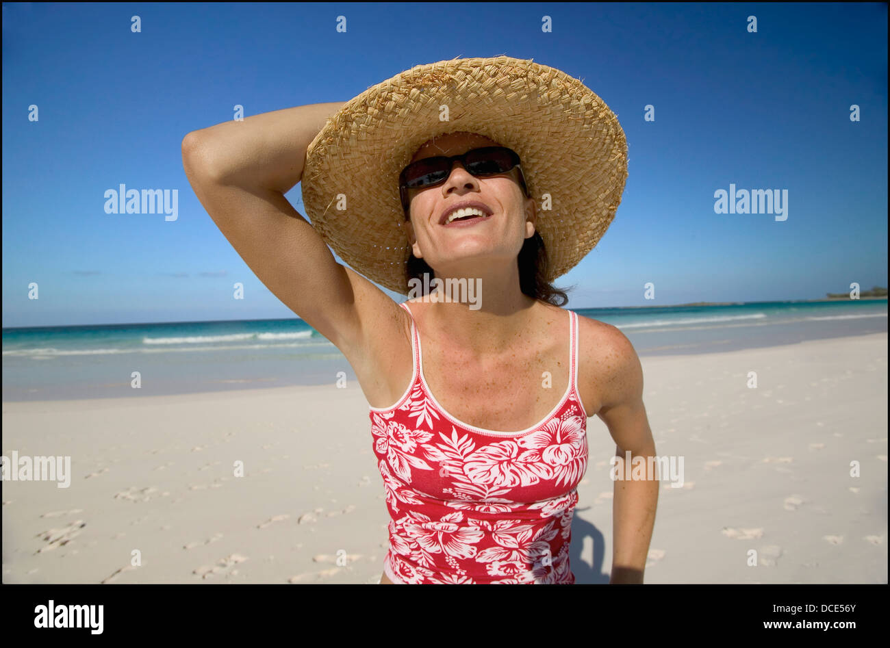 Woman in sunglasses and sun hat on a beach; bahamas Stock Photo - Alamy