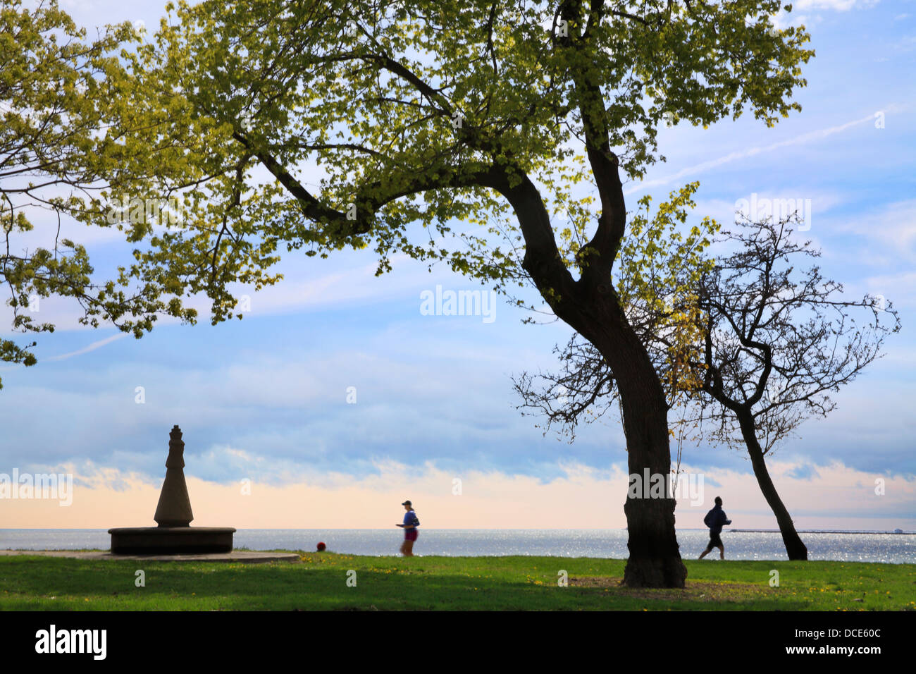 The Chicago Lakefront Trail And Joggers Framed By Foreground Trees With ...