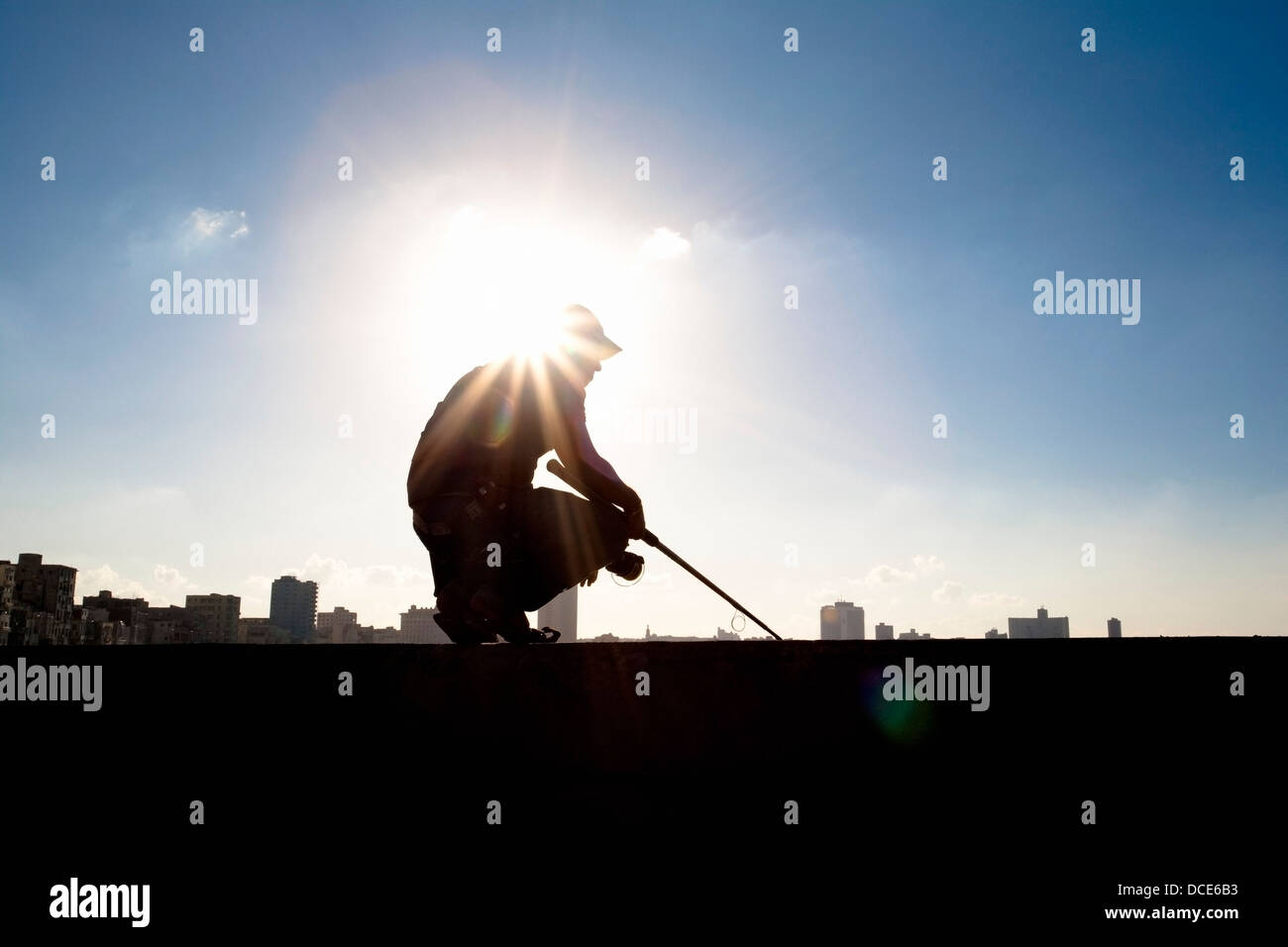 Man stooping hi-res stock photography and images - Alamy