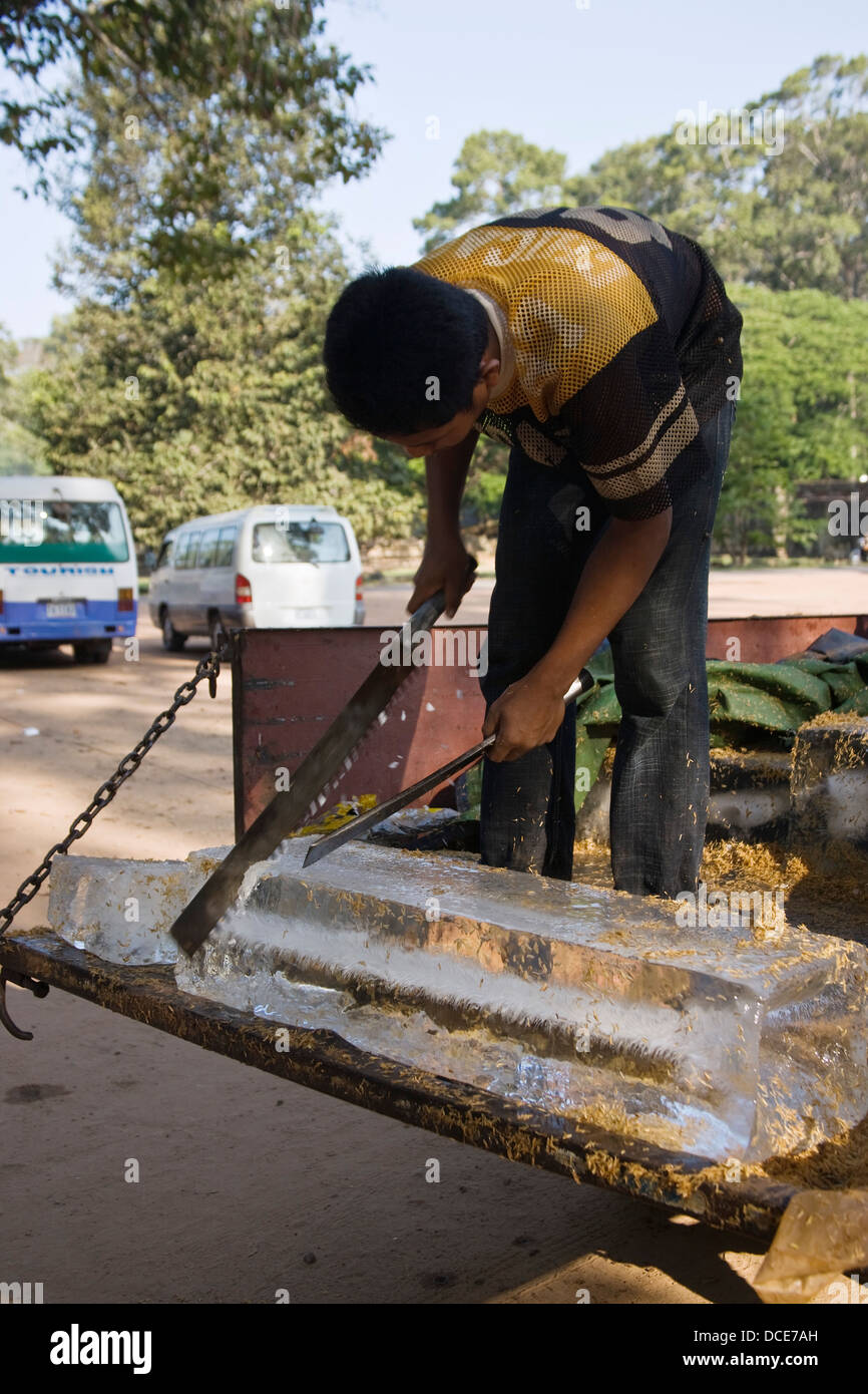 Young Man Chipping Ice Stock Photo - Alamy